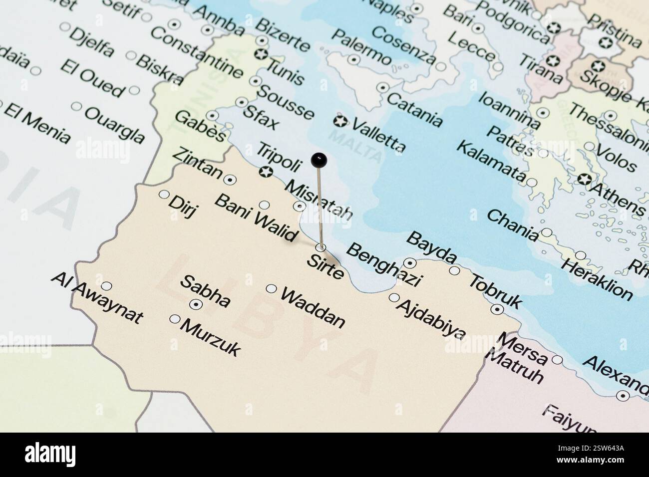 black pin needle into sirte city of libya political map Stock Photo - Alamy
