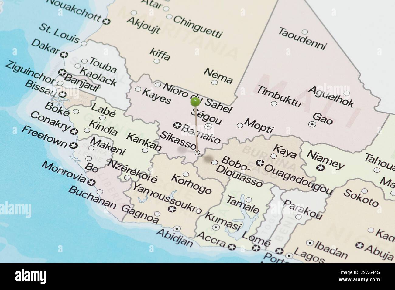red pin needle into sikasso city of mali political map Stock Photo - Alamy
