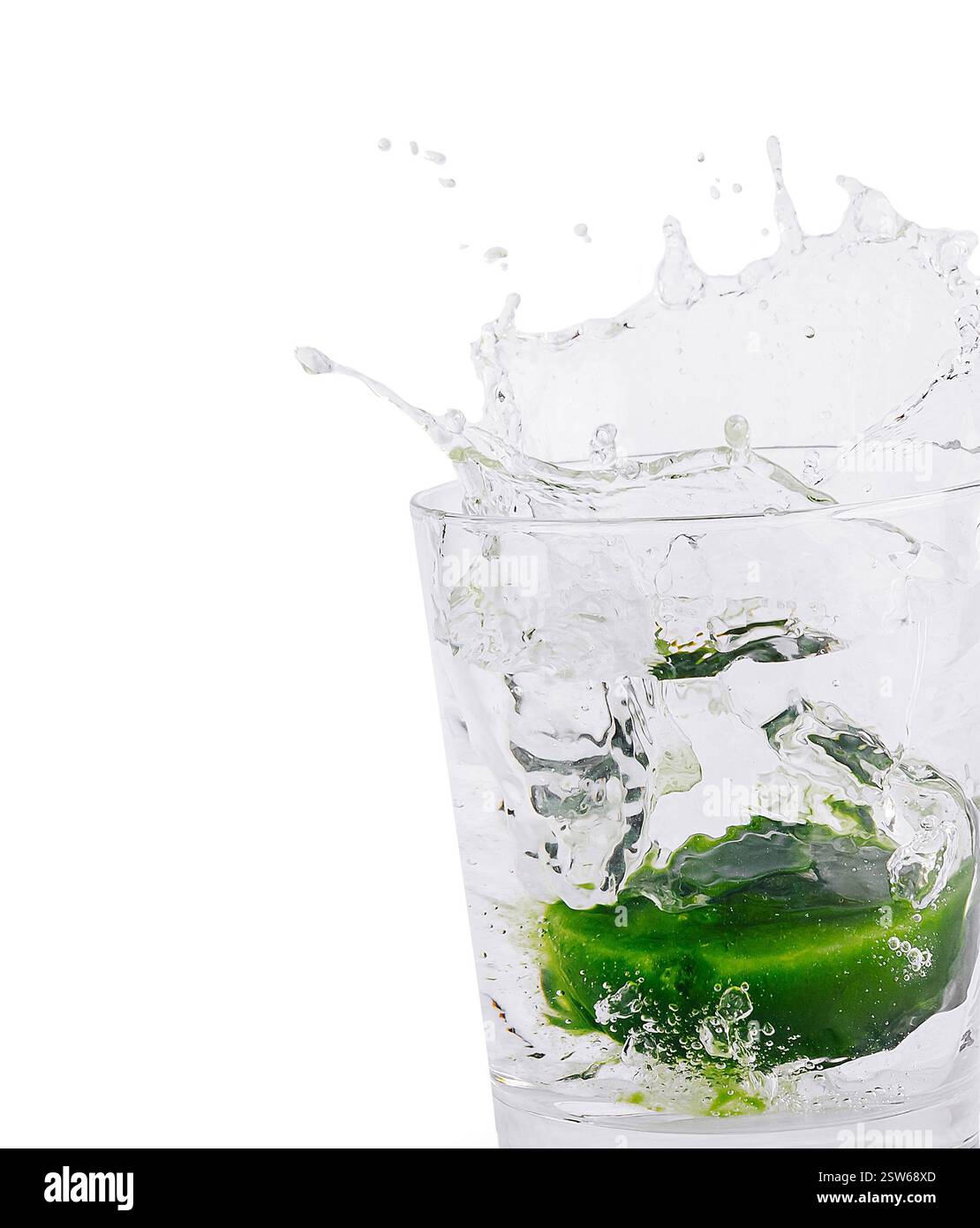 Fresh splash with lime in glass of water Stock Photo - Alamy