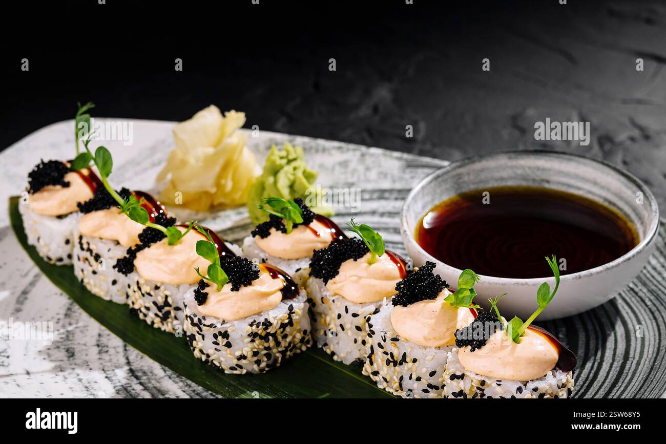 Gourmet sushi roll platter with caviar and soy sauce Stock Photo - Alamy