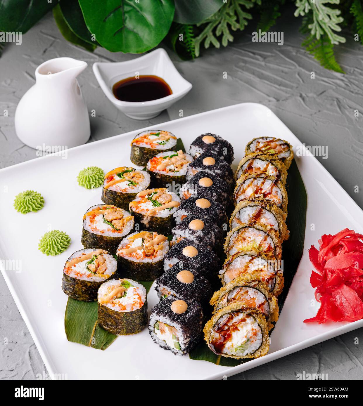 Assorted sushi rolls platter with dipping sauce Stock Photo - Alamy