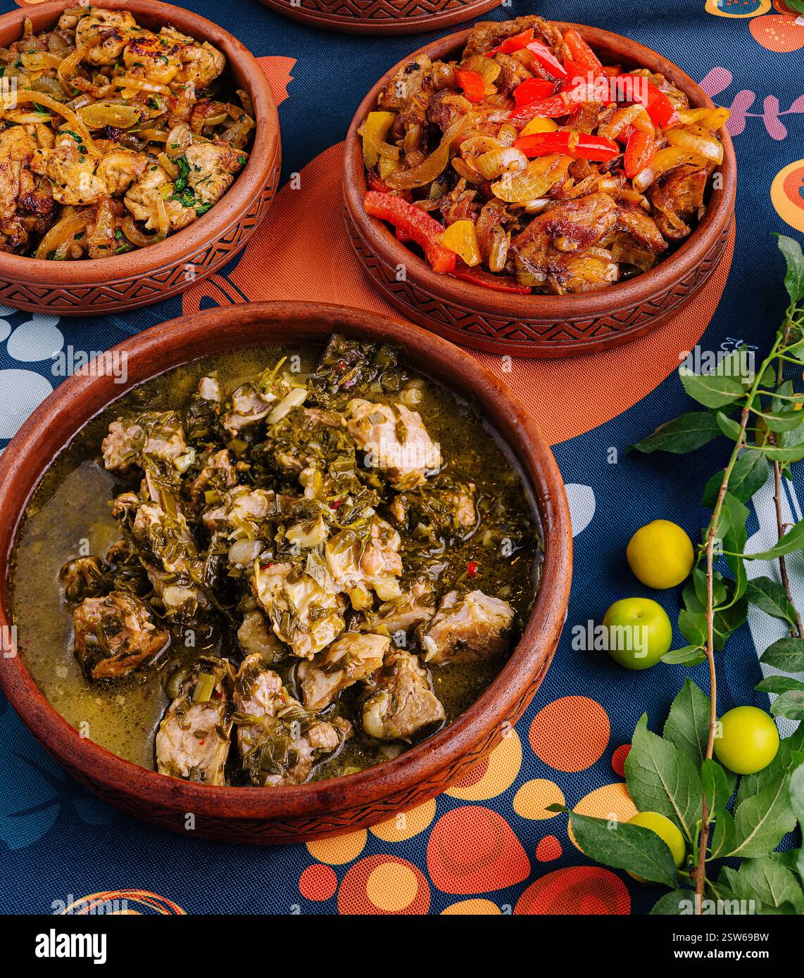 Traditional african stews served in clay pots Stock Photo - Alamy
