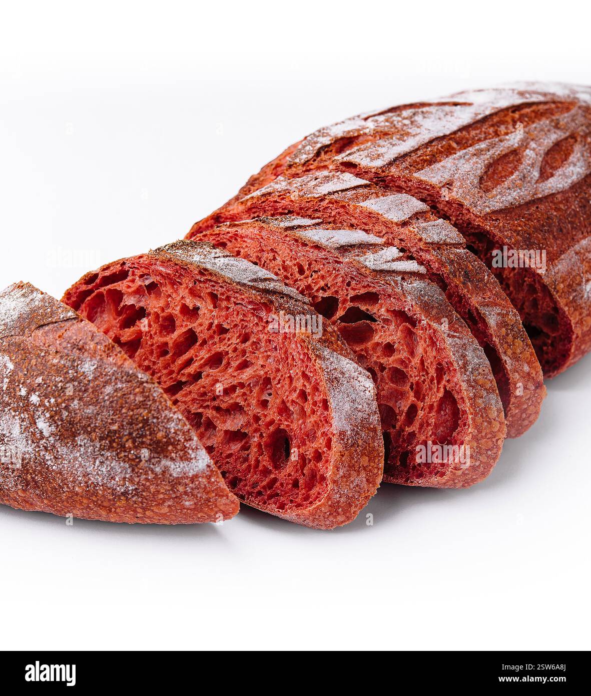 Vibrant sliced loaf of beetroot bread isolated on a white background ...