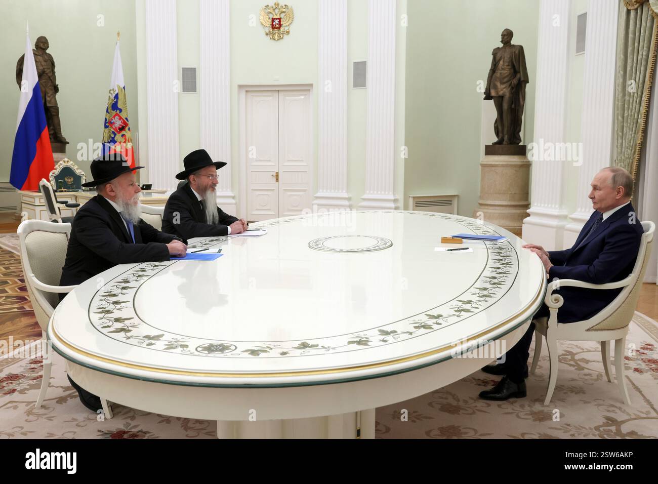 Russian President Vladimir Putin, right, speaks to Chief Rabbi of ...
