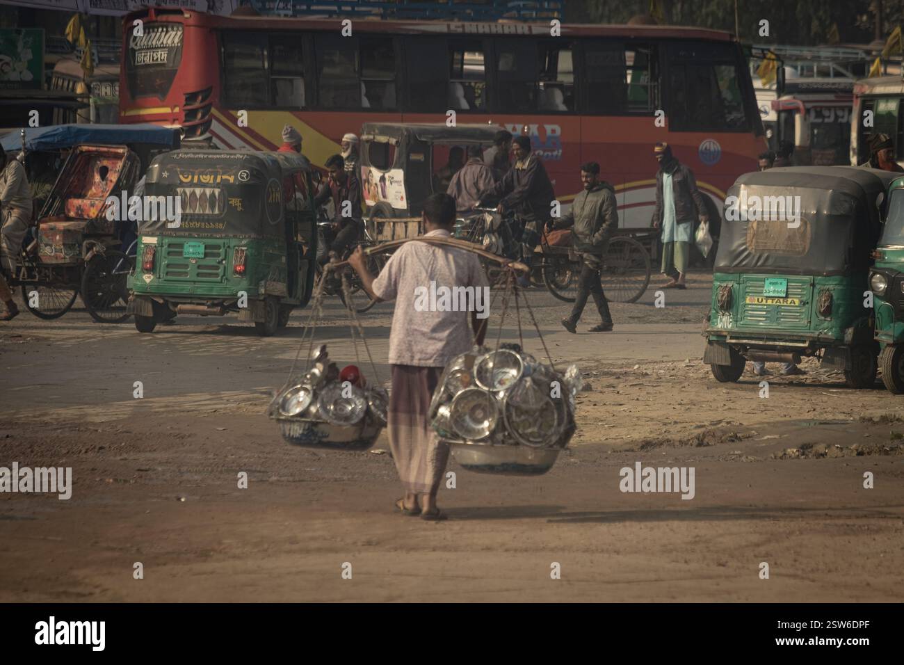 Bangladeshi man selling kitchen utensils on the street in Chittagong ...