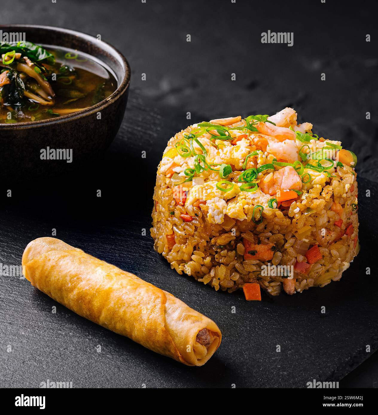 Gourmet asian fusion meal on slate background Stock Photo - Alamy