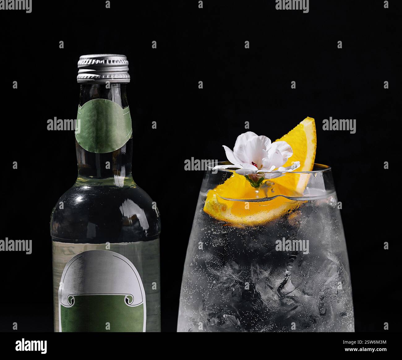 Refreshing gin and tonic cocktail with citrus garnish Stock Photo - Alamy