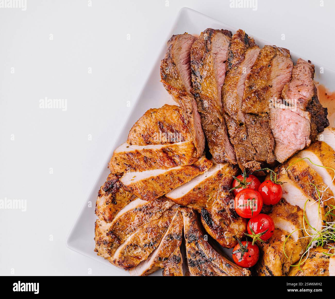 Gourmet grilled meat platter with fresh vegetables Stock Photo - Alamy