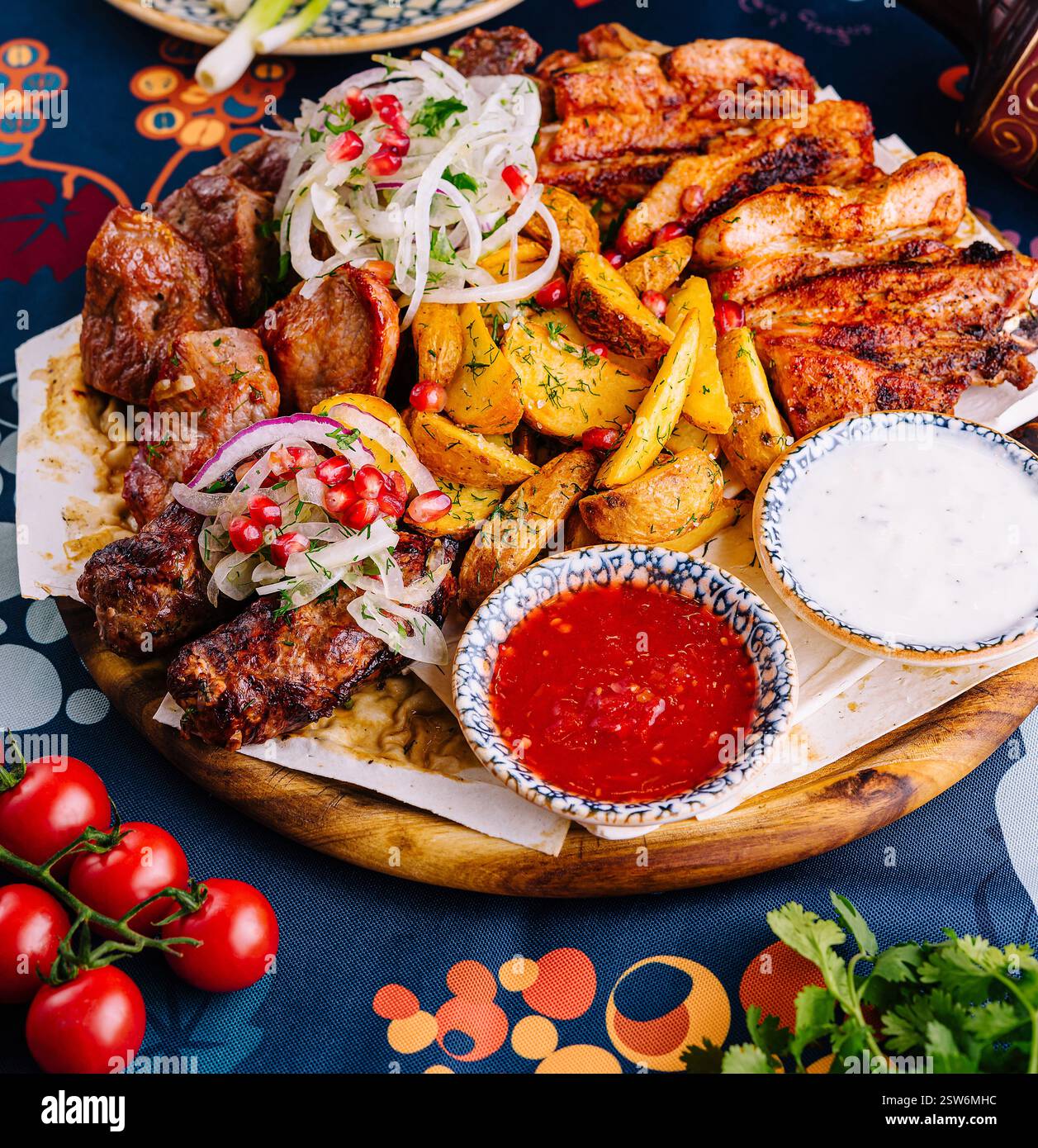 Traditional georgian feast with assorted grilled meats Stock Photo - Alamy