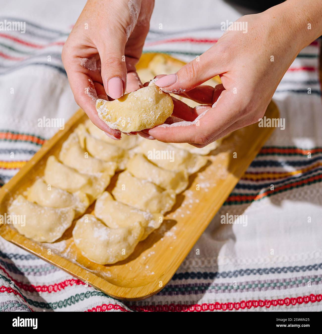 Traditional dumpling preparation by hands Stock Photo - Alamy