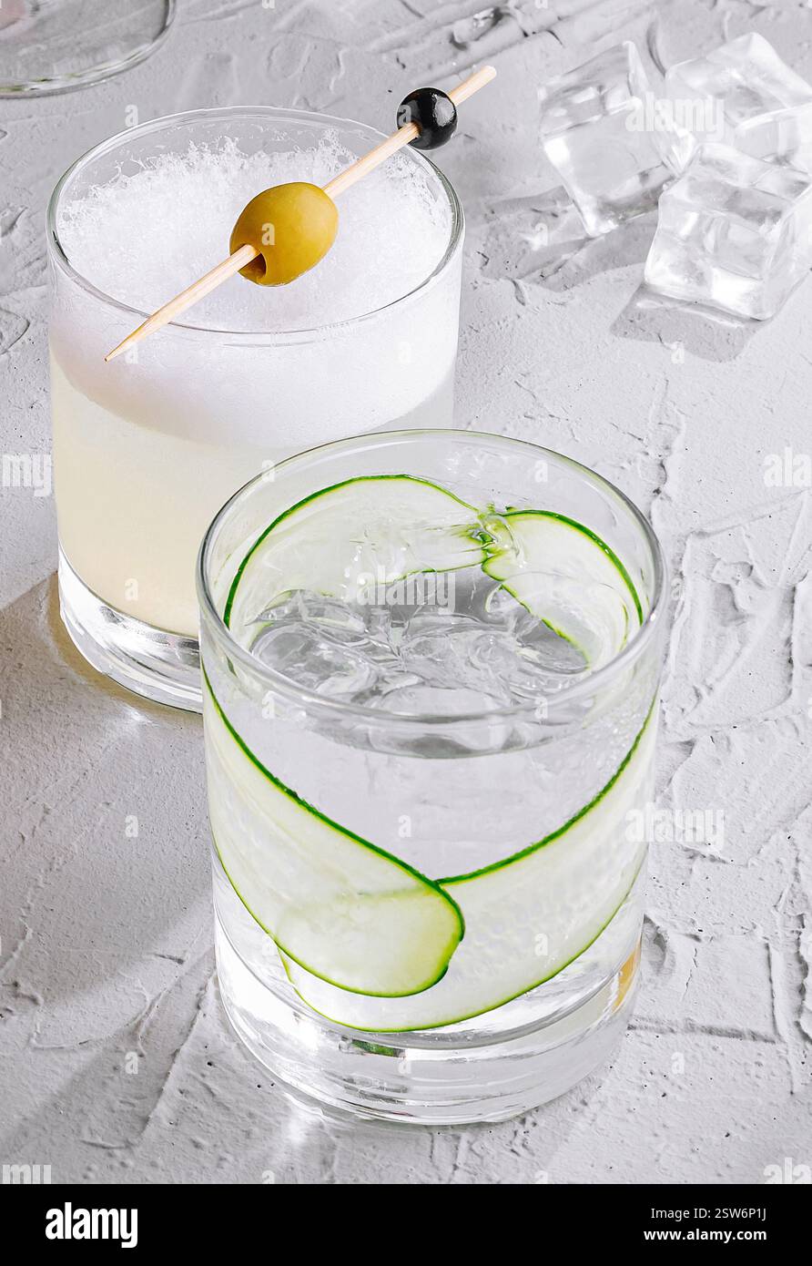 Variety of refreshing cocktails with garnishes arranged on a table with ...