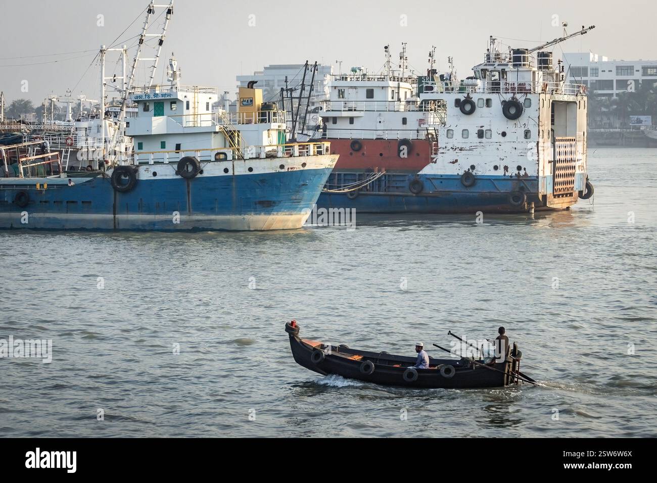 Port of Chittagong traditional cargo and fishing boats on the water ...