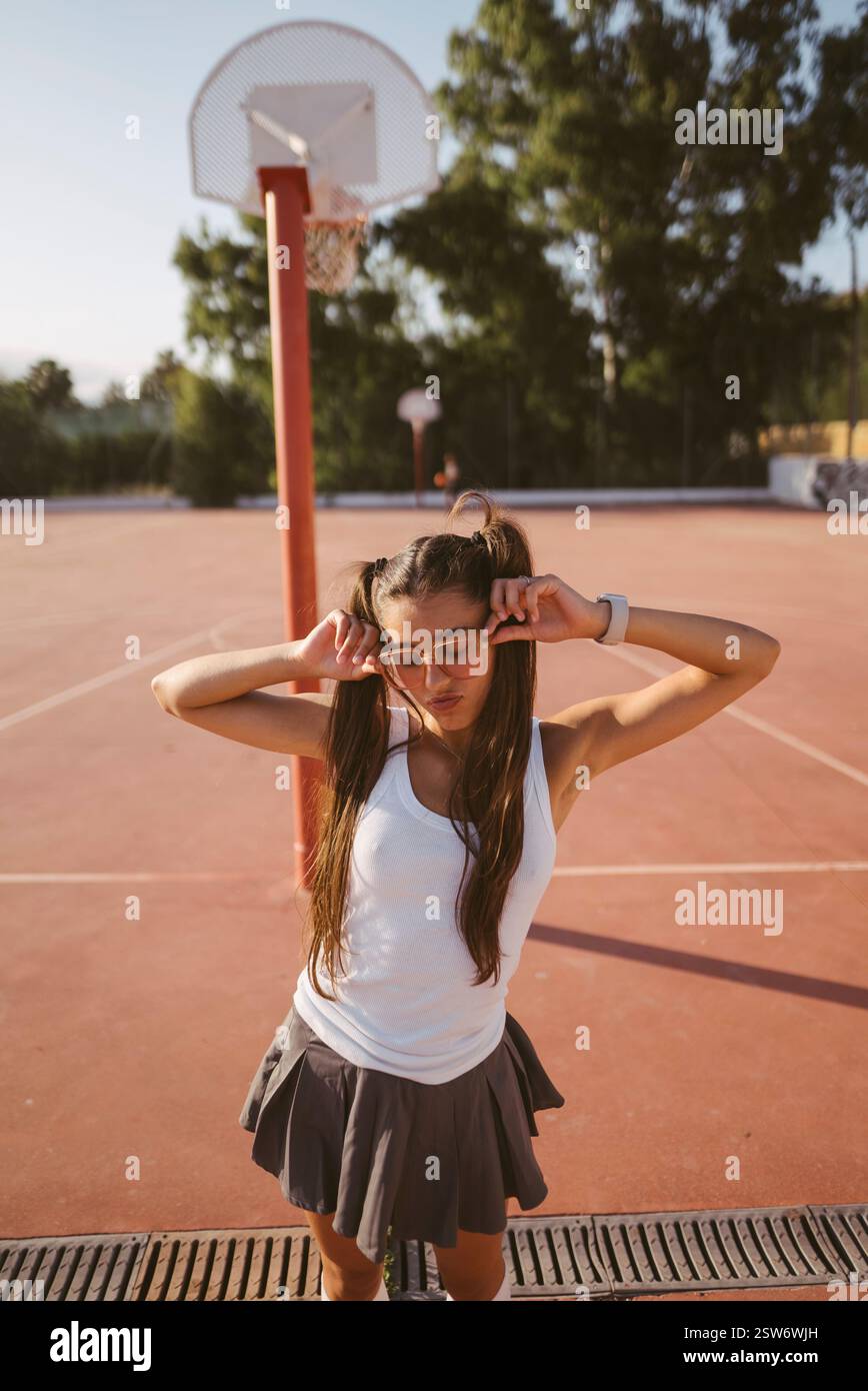A Playful Teen Enjoying Time on the Basketball Court, Engaging in Fun ...