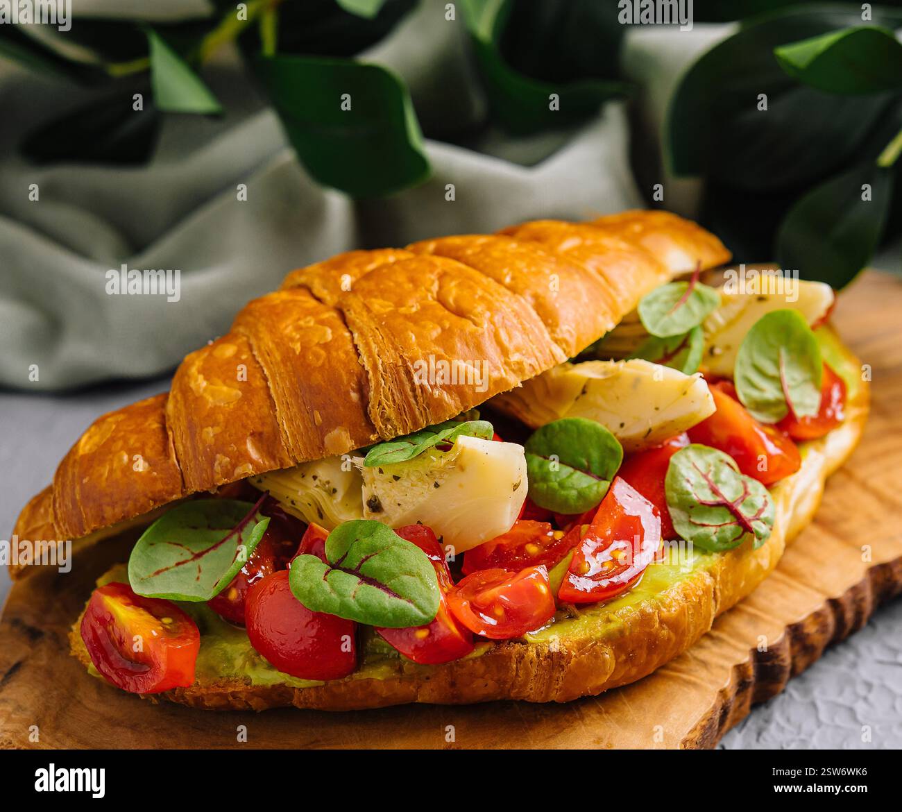 Gourmet tomato and mozzarella croissant sandwich Stock Photo - Alamy