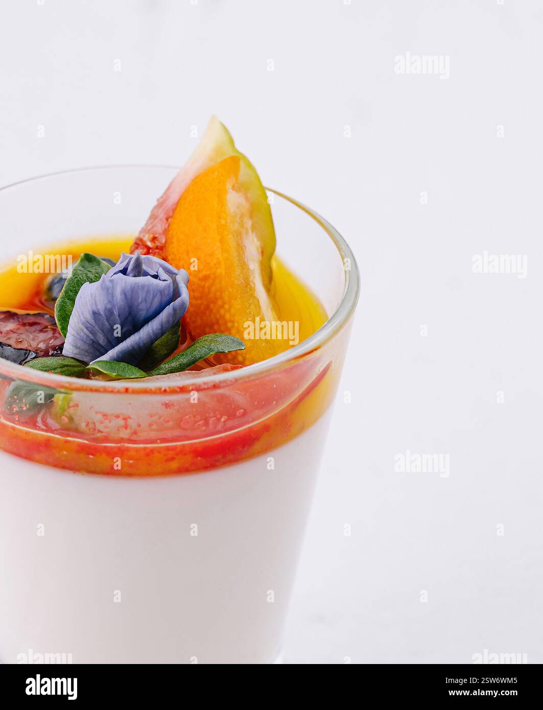 Gourmet panna cotta with fruit garnish Stock Photo - Alamy