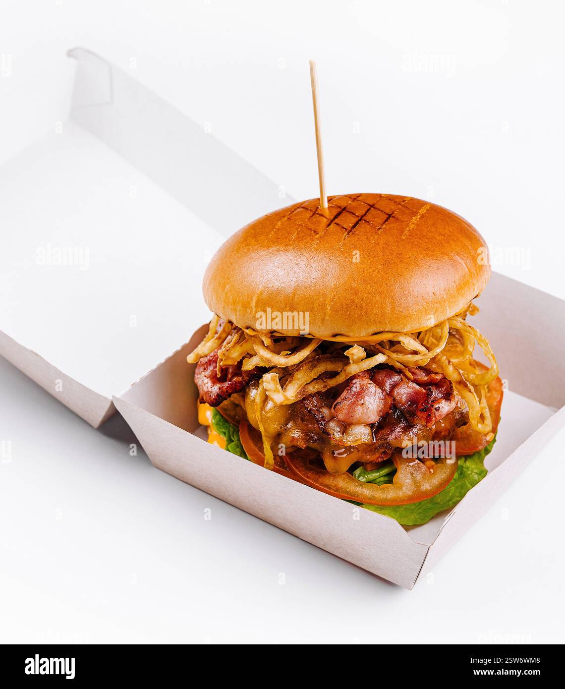 Gourmet burger in takeout box on white background Stock Photo - Alamy
