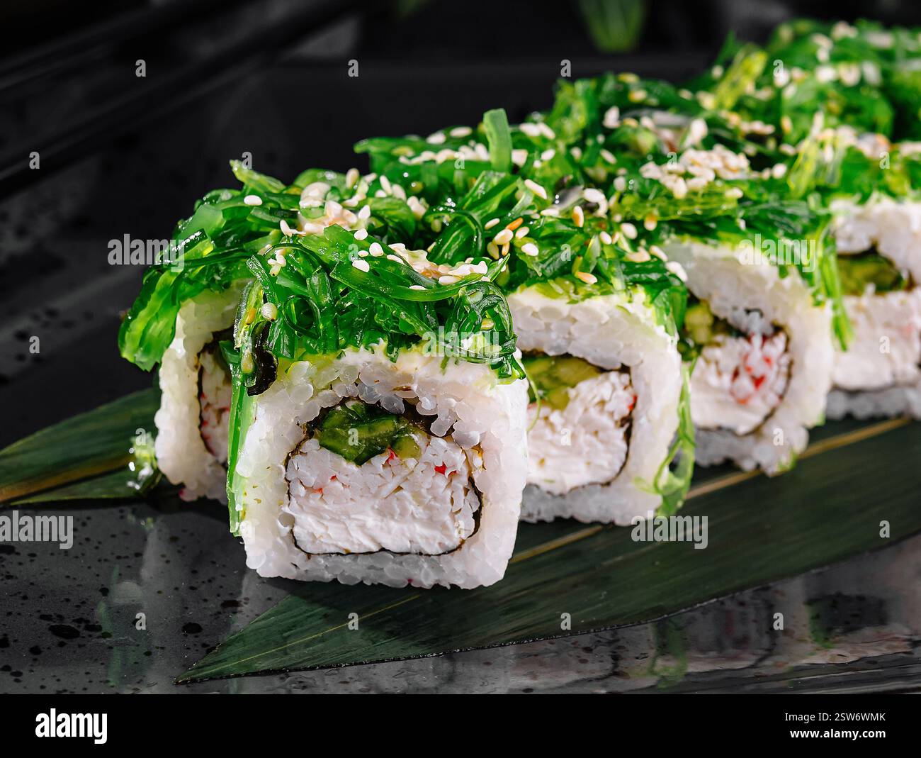 Gourmet sushi roll platter on elegant dark setting Stock Photo - Alamy
