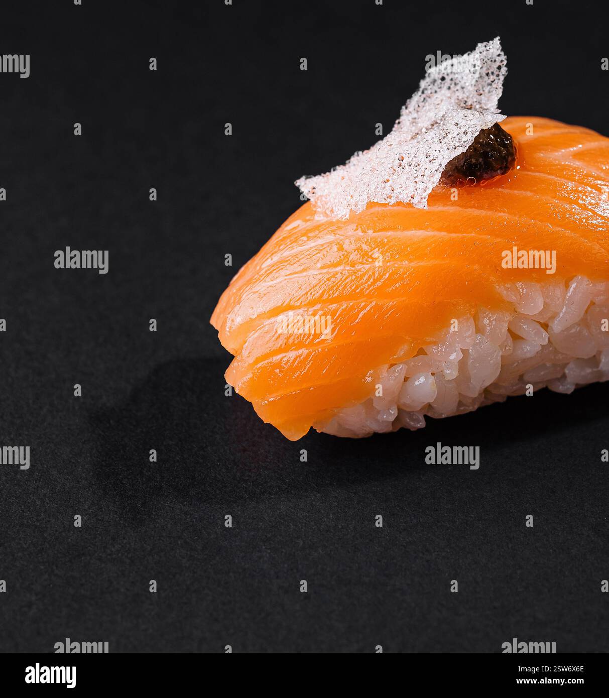 Exquisite salmon nigiri sushi on black background Stock Photo - Alamy