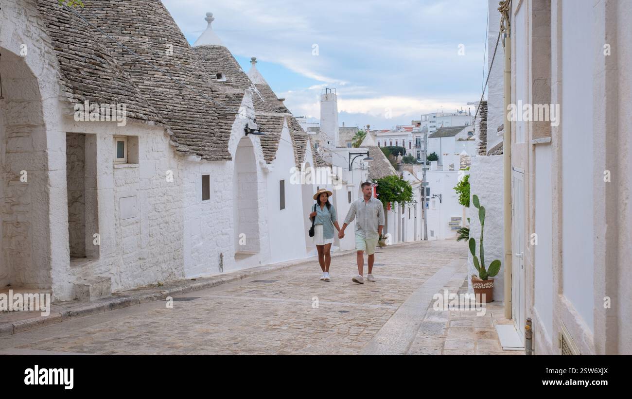 Exploring the charming streets of Puglia, Italy, hand in hand under the ...