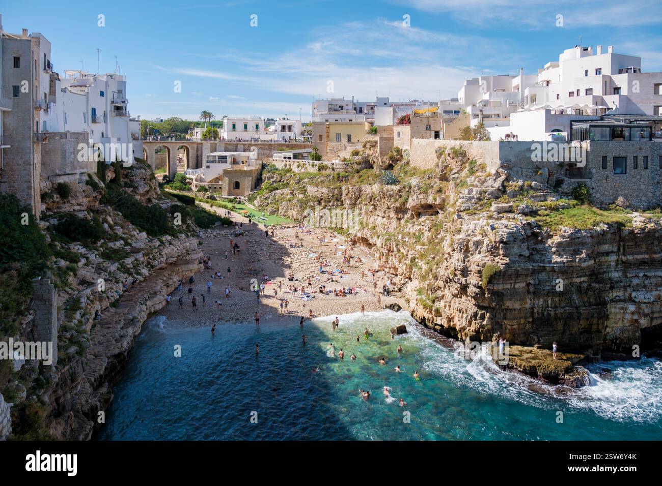 Polignano a Mare Nestled in the stunning cliffs of Puglia, people enjoy ...