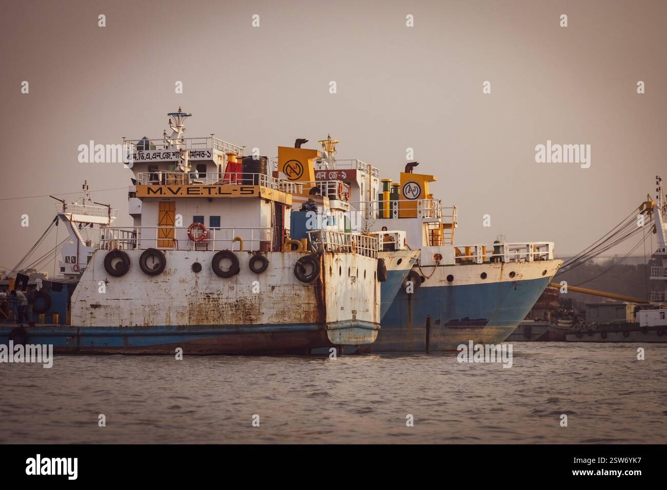Port of Chittagong traditional cargo and fishing boats on the water ...