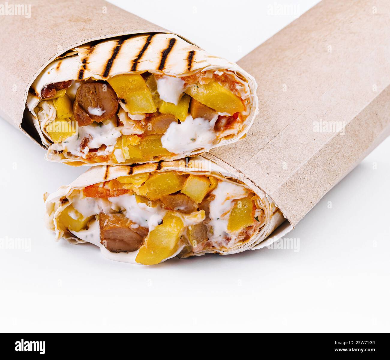 Fresh chicken wrap halved on white background Stock Photo - Alamy