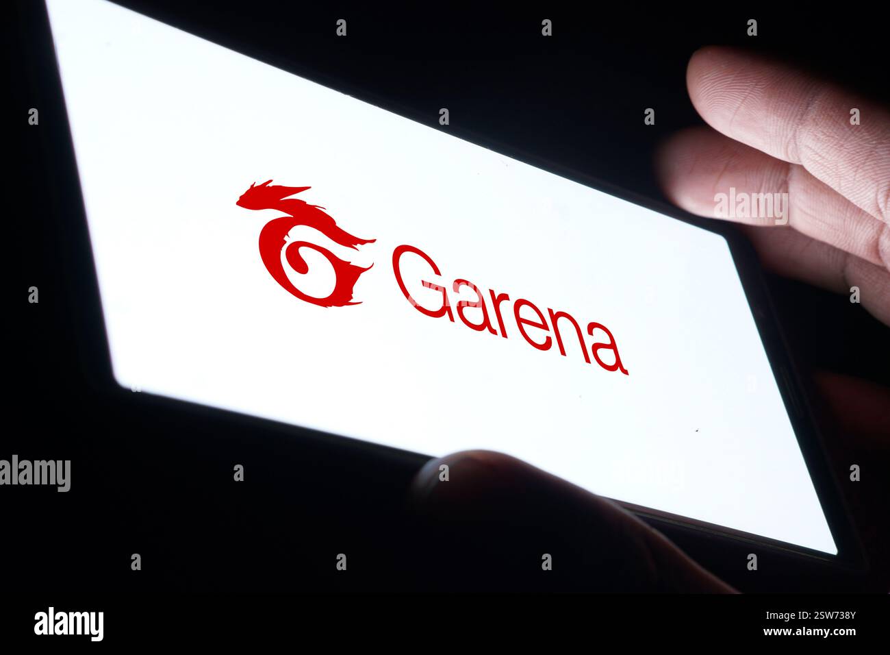 Dhaka, Bangladesh- 10 Oct 2024: Garena logo is displayed on smartphone ...