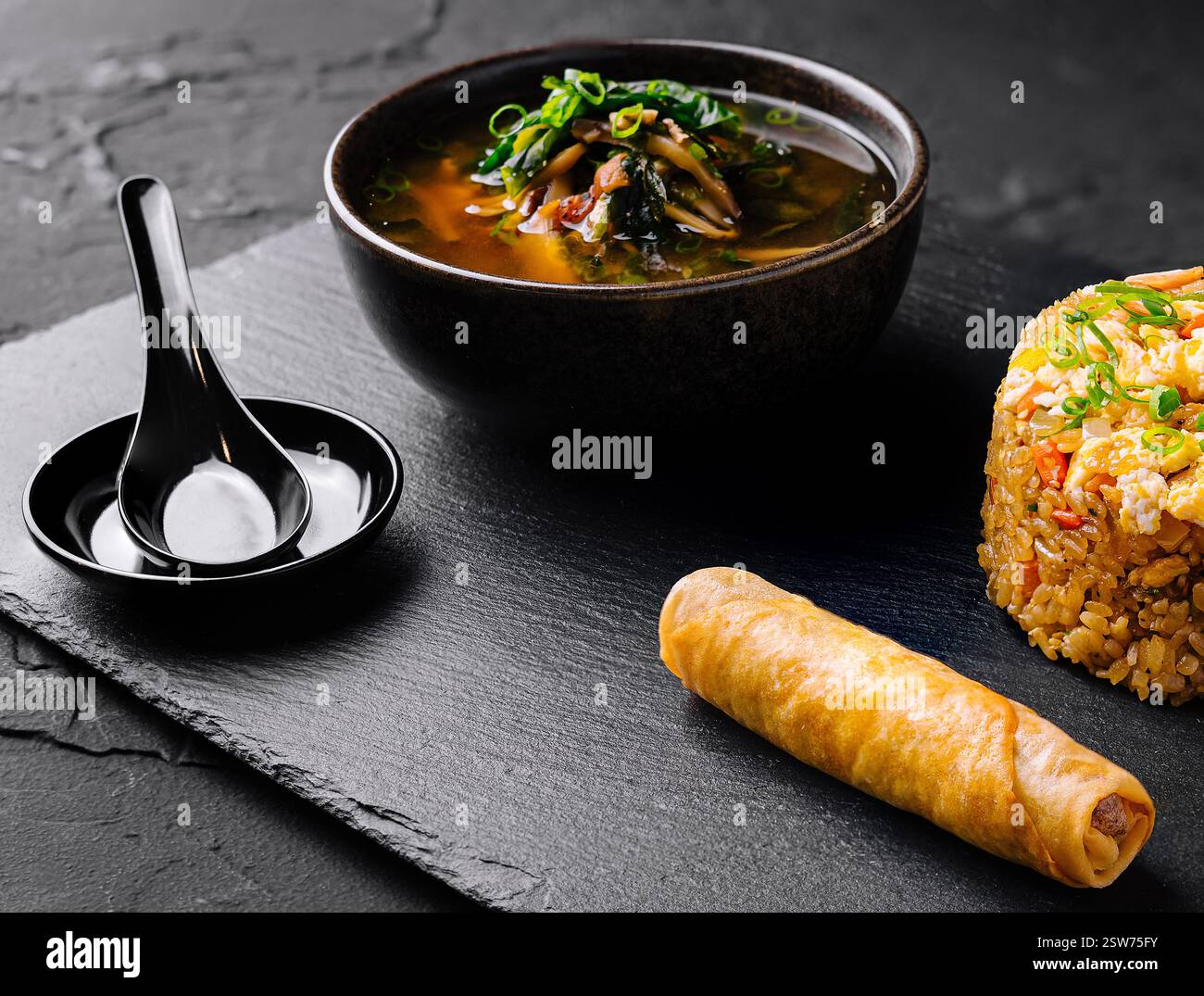 Gourmet asian fusion meal on slate background Stock Photo - Alamy