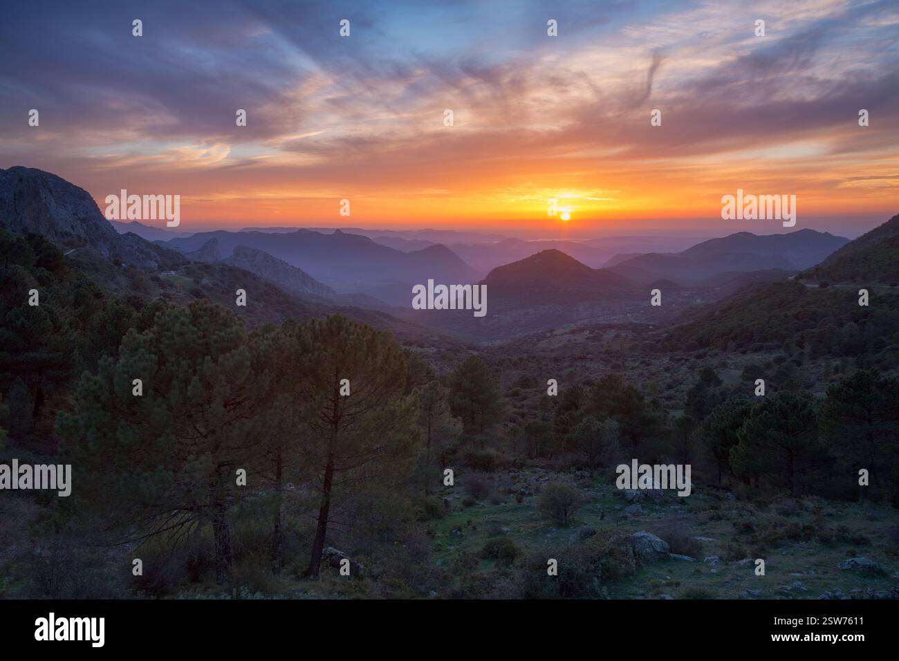 Puerto del Boyar sunset: mountain silhouettes, lush forest, pastel sky ...