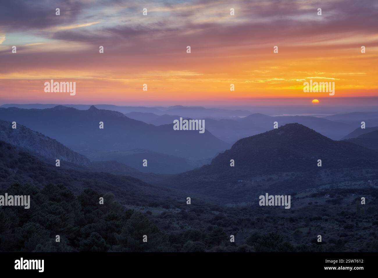 Puerto del Boyar sunset: mountain silhouettes, lush forest, pastel sky ...