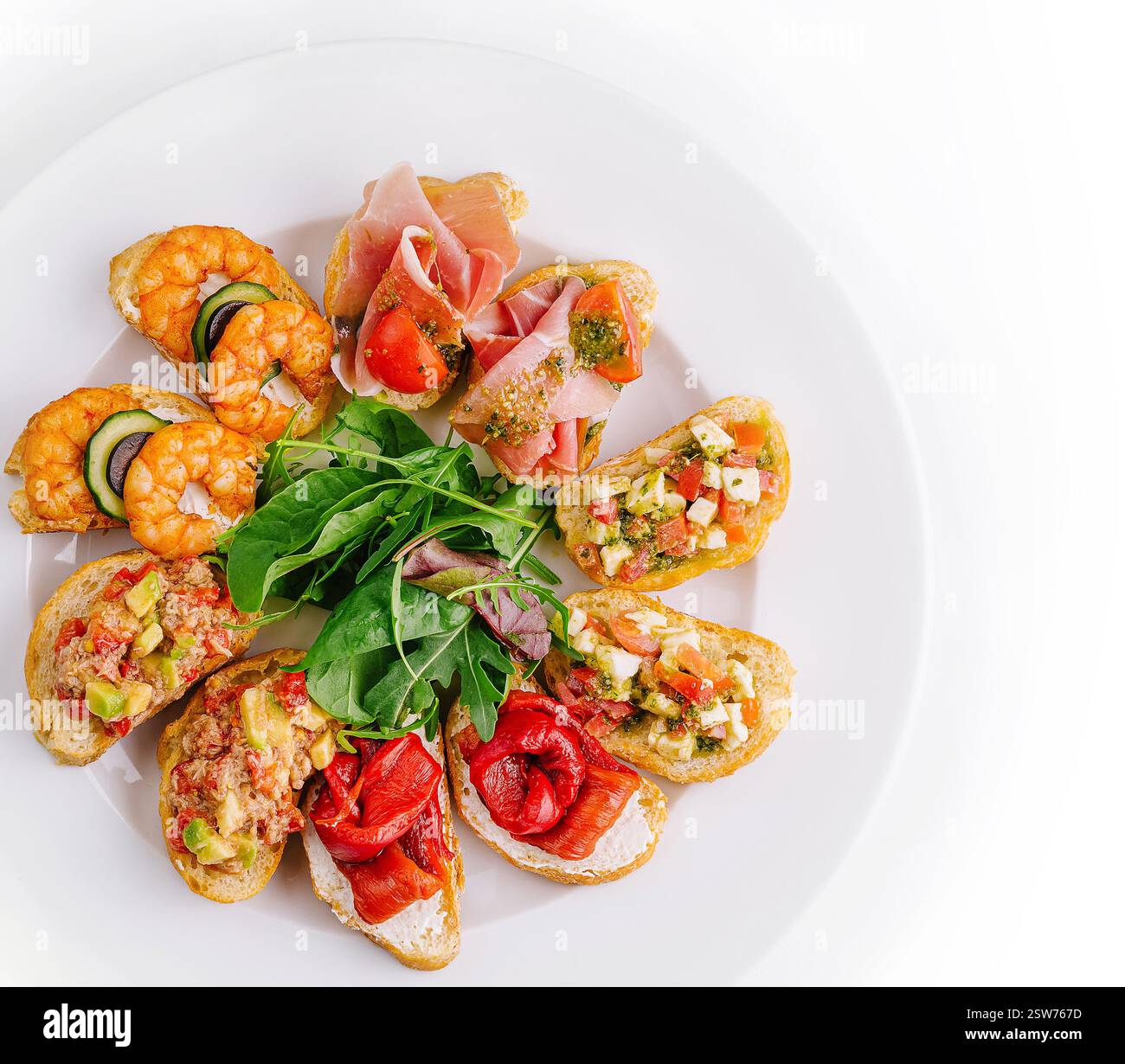 Gourmet bruschetta platter on white background Stock Photo - Alamy