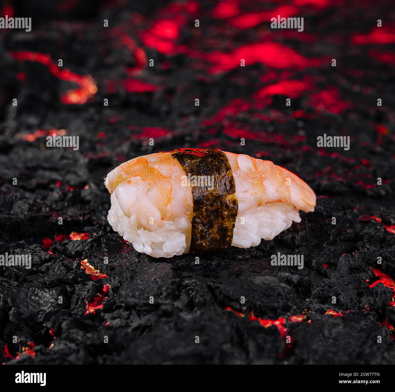 Shrimp sushi on a black lava rock with glowing red textures Stock Photo ...