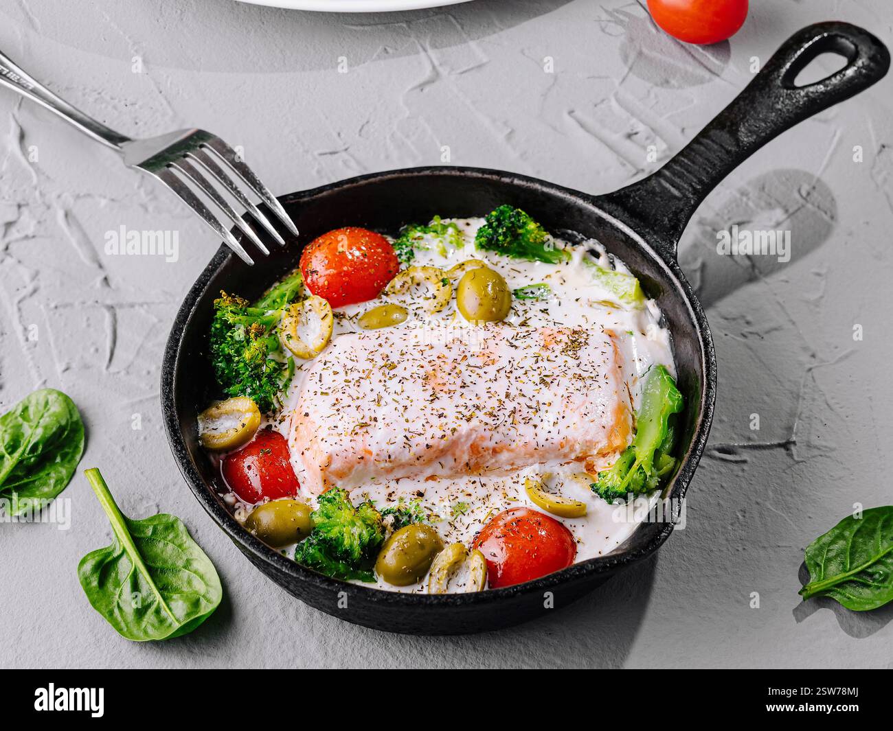 Wholesome dish featuring pan seared fish with vegetables hi-res stock ...