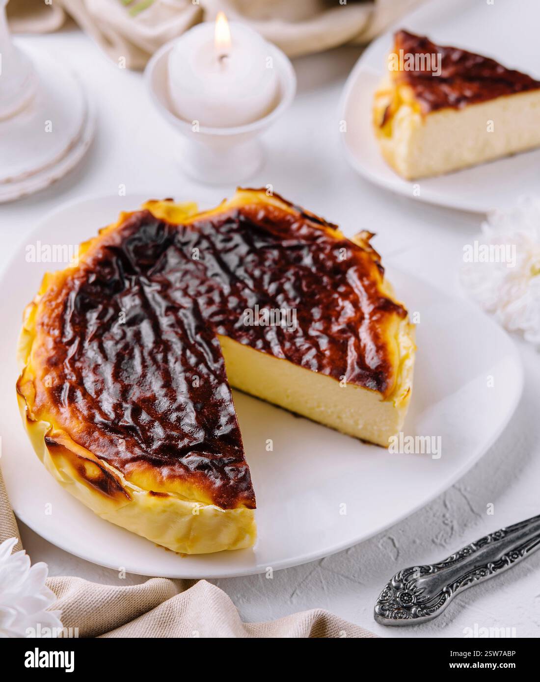 Traditional basque burnt san sebastian cheesecake slice on elegant ...