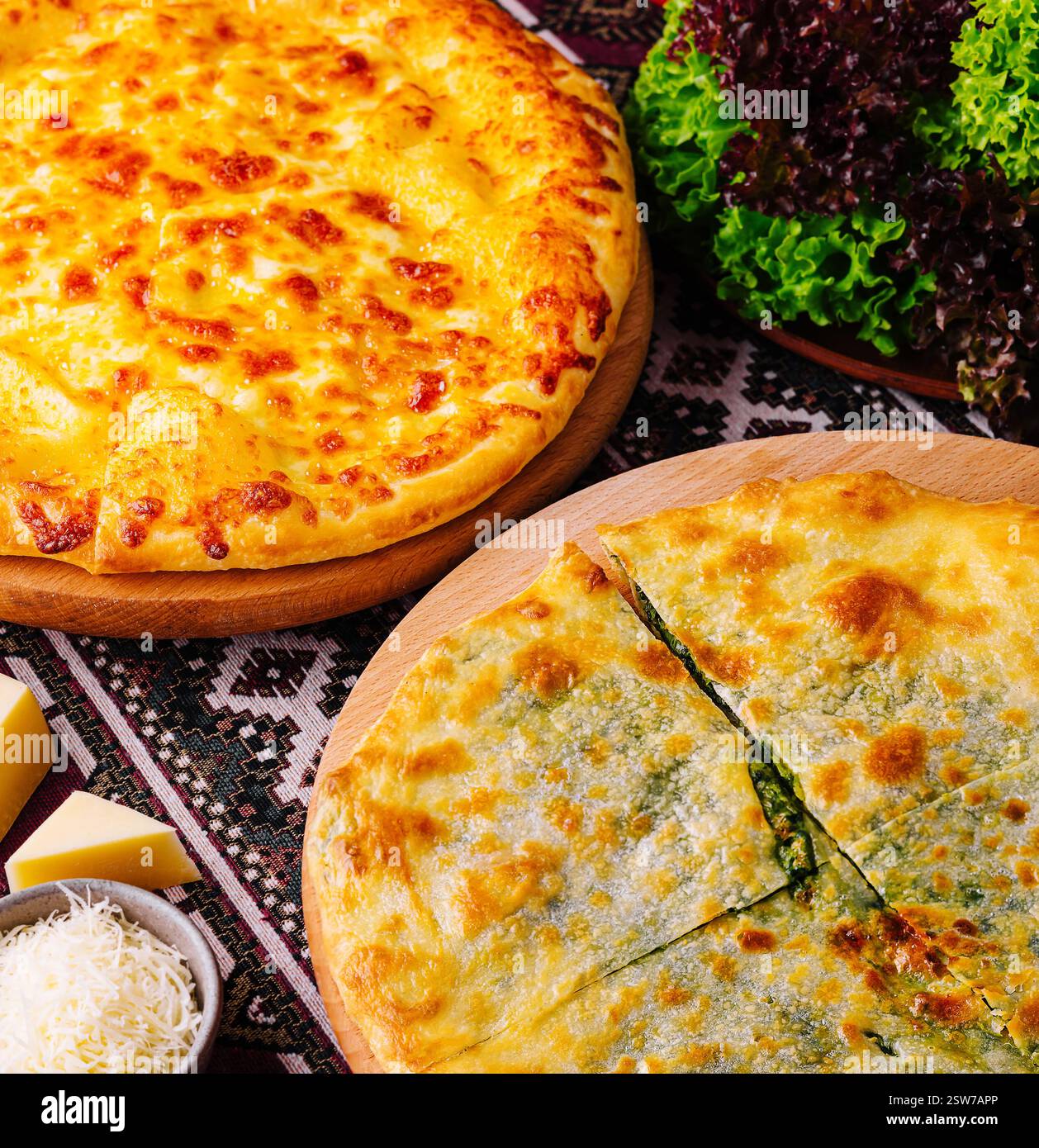 Savory cheese pizzas or khachapuri on rustic table setting Stock Photo ...