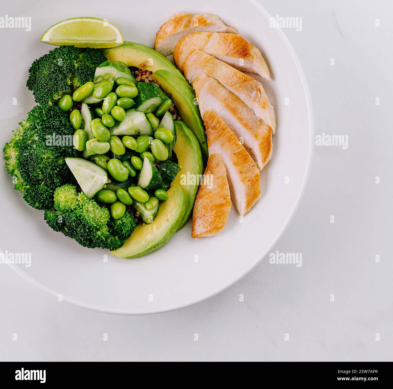 Healthy grilled chicken plate with vegetables and lime Stock Photo - Alamy