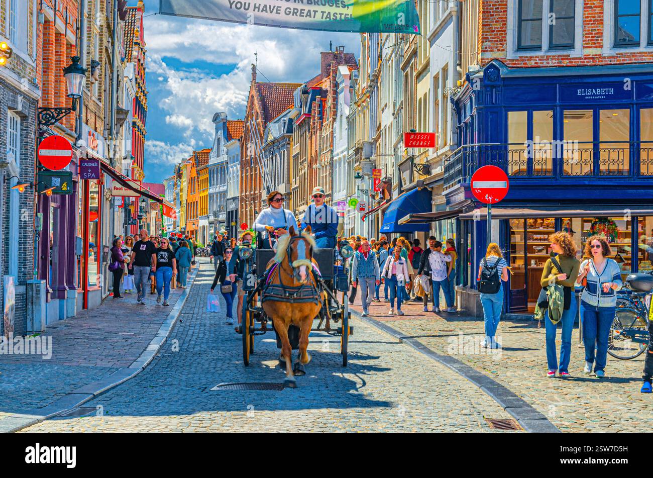 Bruges, Belgium, July 5, 2023: crowd of tourists walking down ...