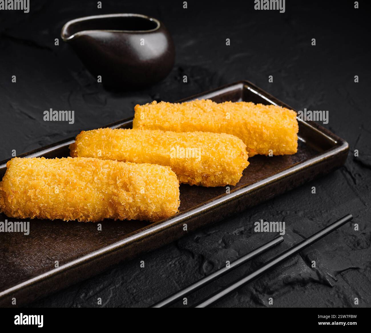 Crispy fried fish rolls with sweet chili sauce Stock Photo - Alamy