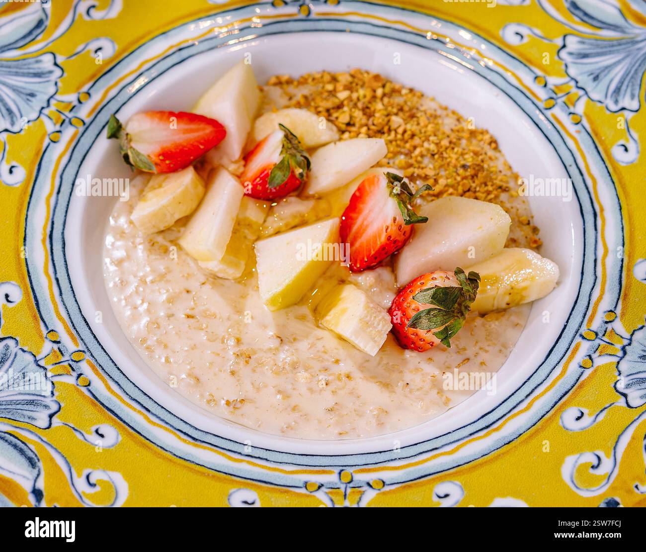 Colorful bowl of oatmeal with fresh fruits Stock Photo - Alamy