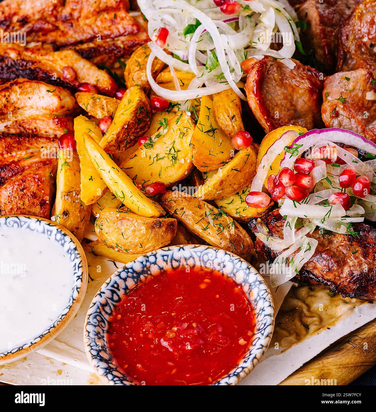 Traditional georgian feast with assorted grilled meats Stock Photo - Alamy