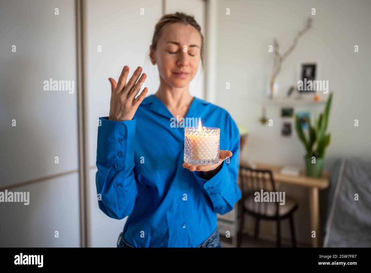 Aromatherapy at home. Balanced woman holding aesthetic burning aroma ...