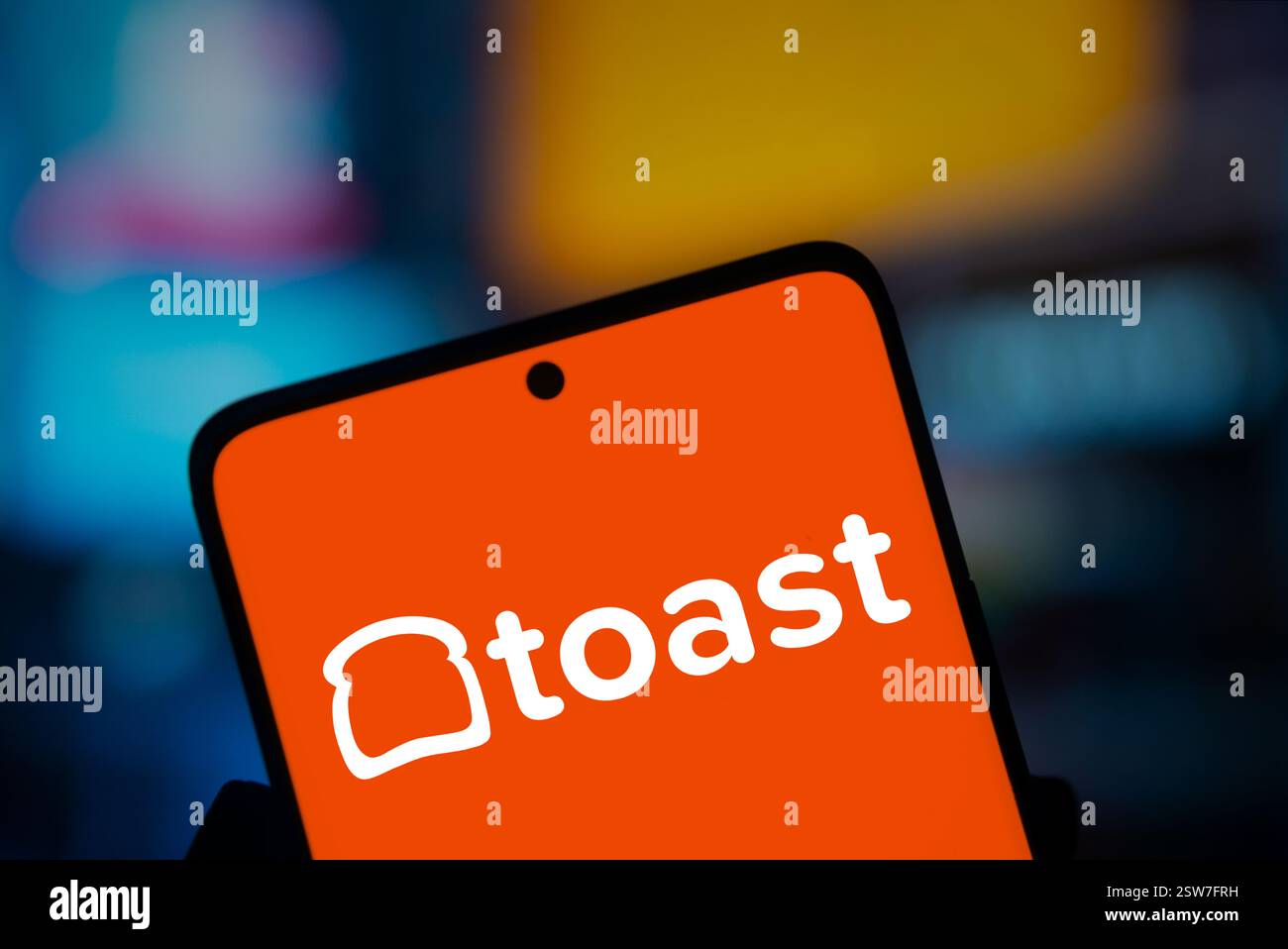 Toast logo is displayed on smartphone hi-res stock photography and ...