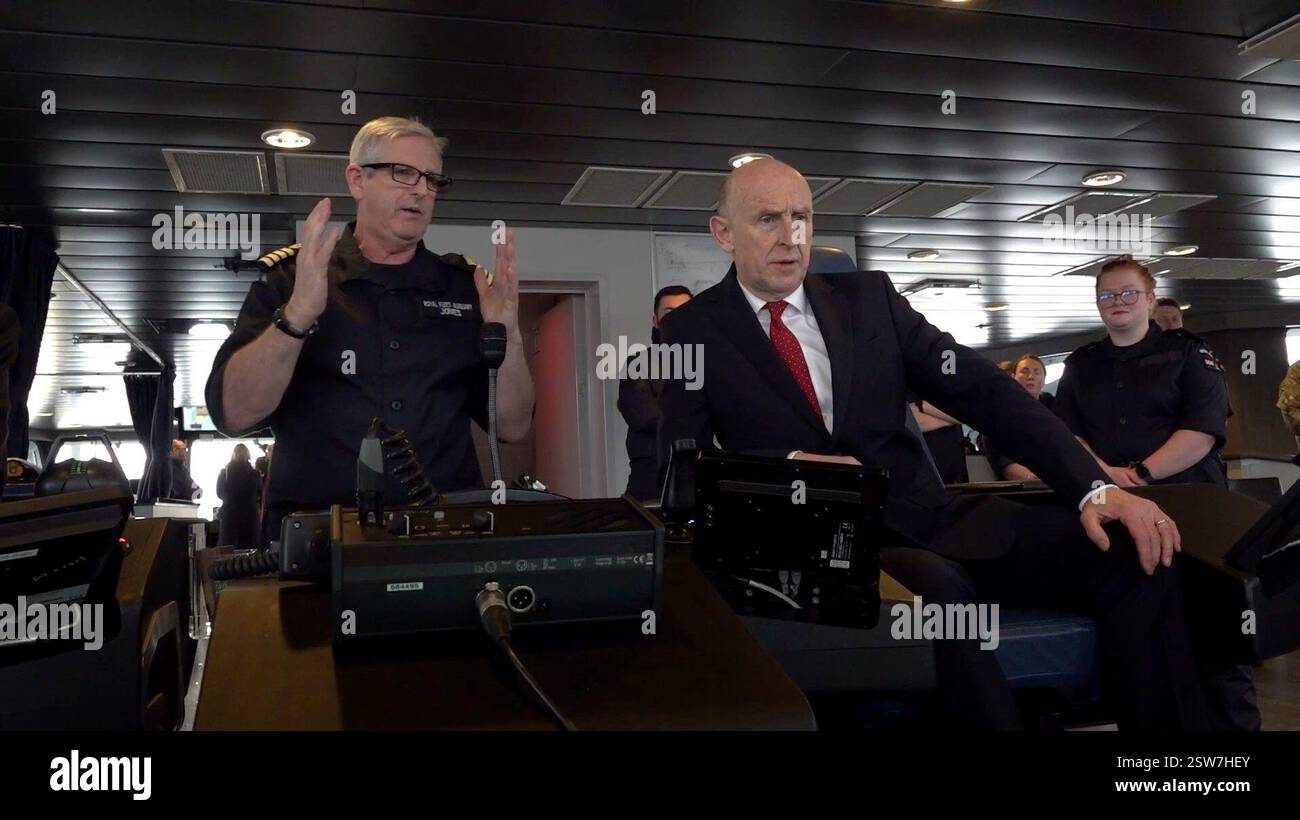 Screen grab taken from PA Video of Defence Secretary John Healey (right ...
