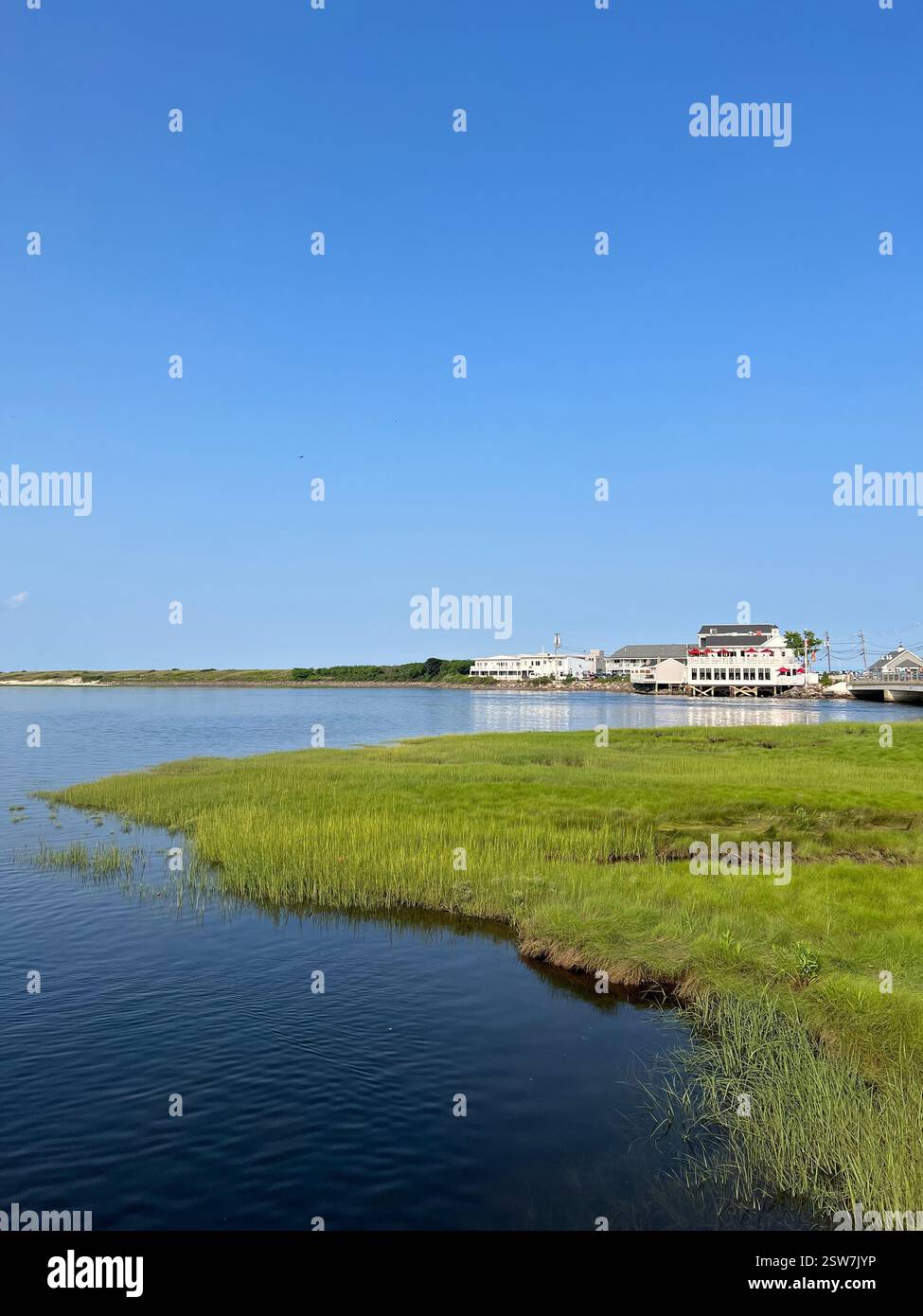 A stunning view over the inlet in coastal Ogunquit, Maine, with lush ...
