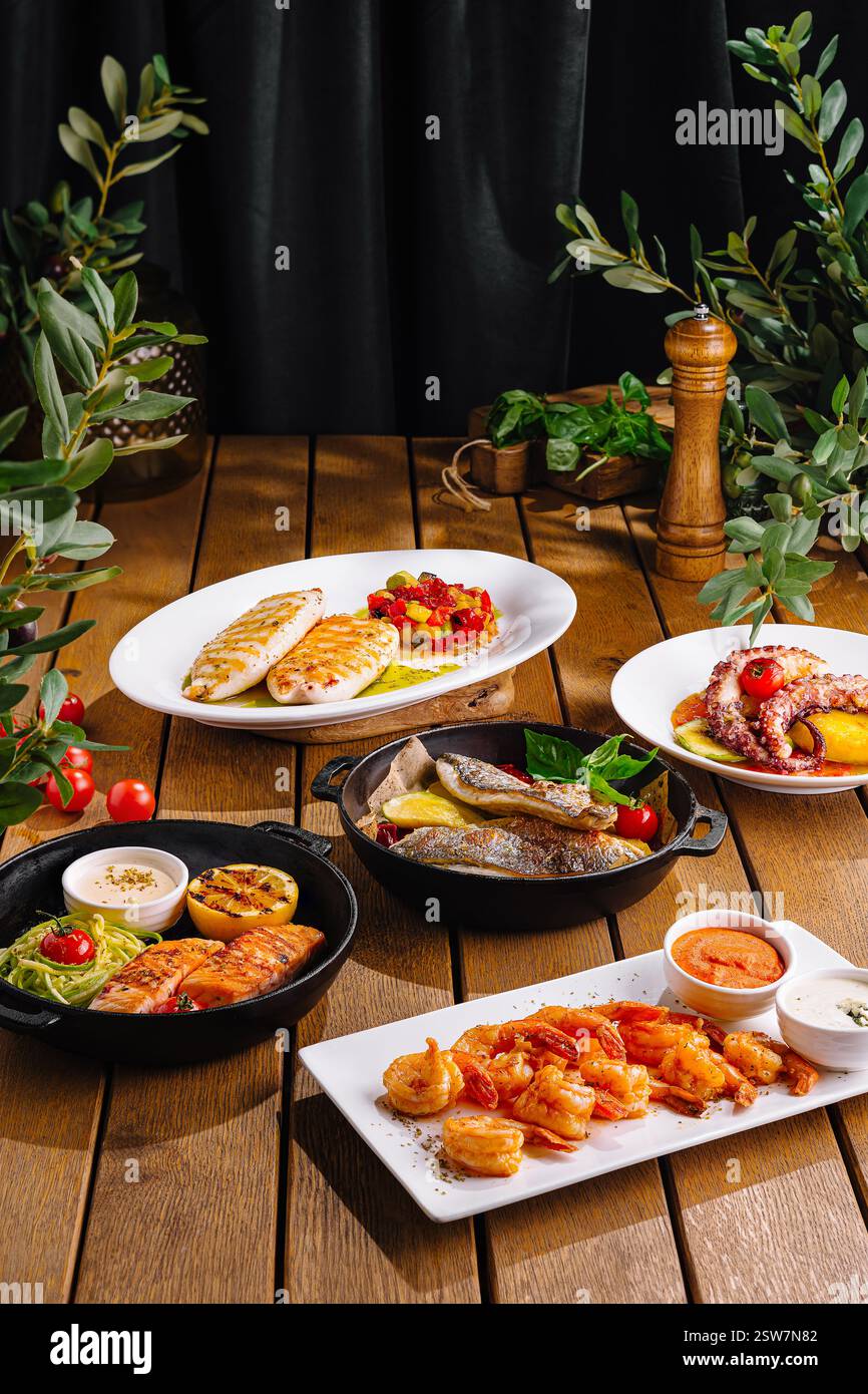 Gourmet seafood mediterranean feast on rustic table Stock Photo - Alamy