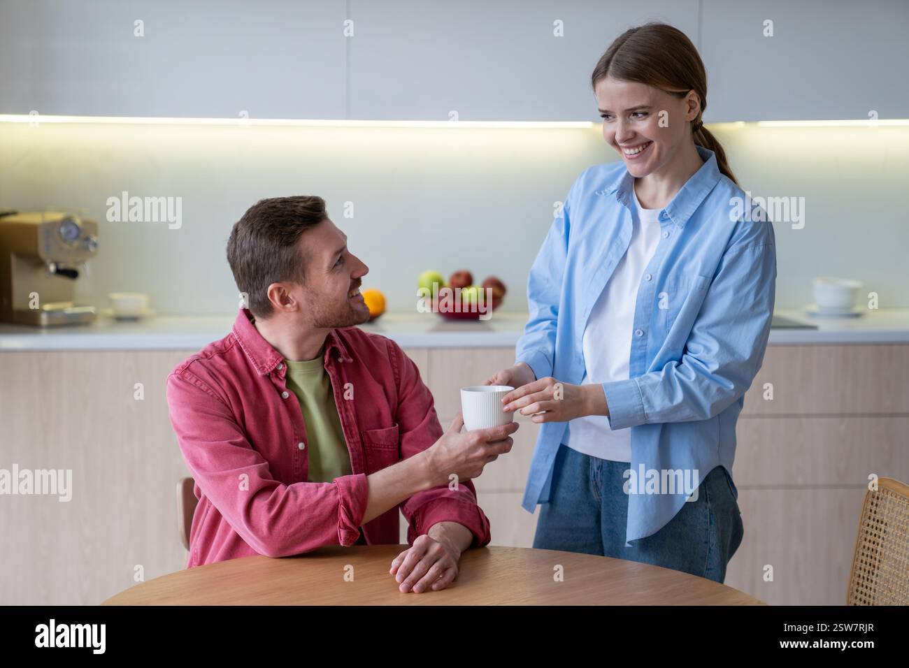 Happy man serves breakfast hi-res stock photography and images - Alamy
