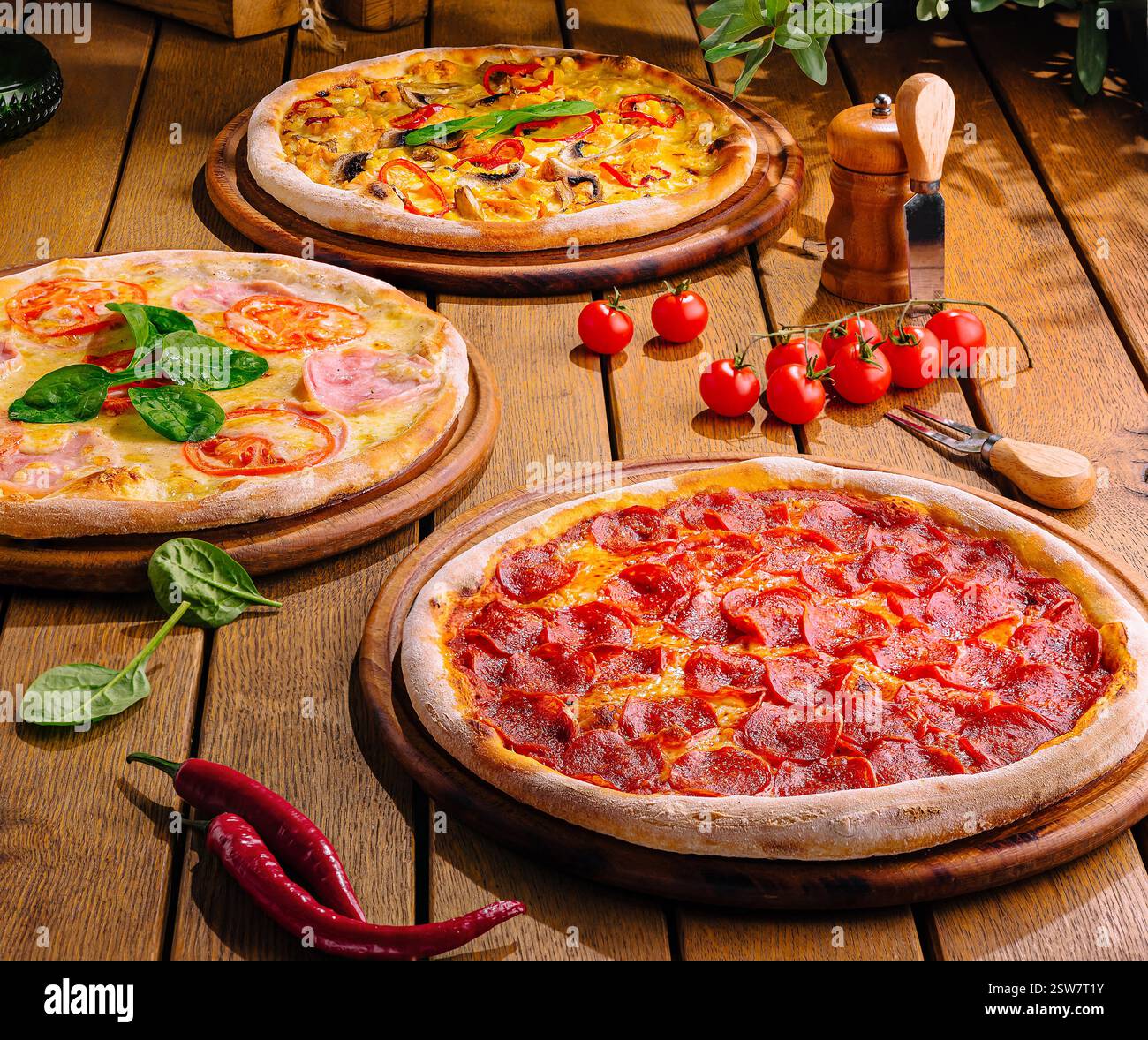 Italian feast: assorted pizzas with wine on wooden table Stock Photo ...