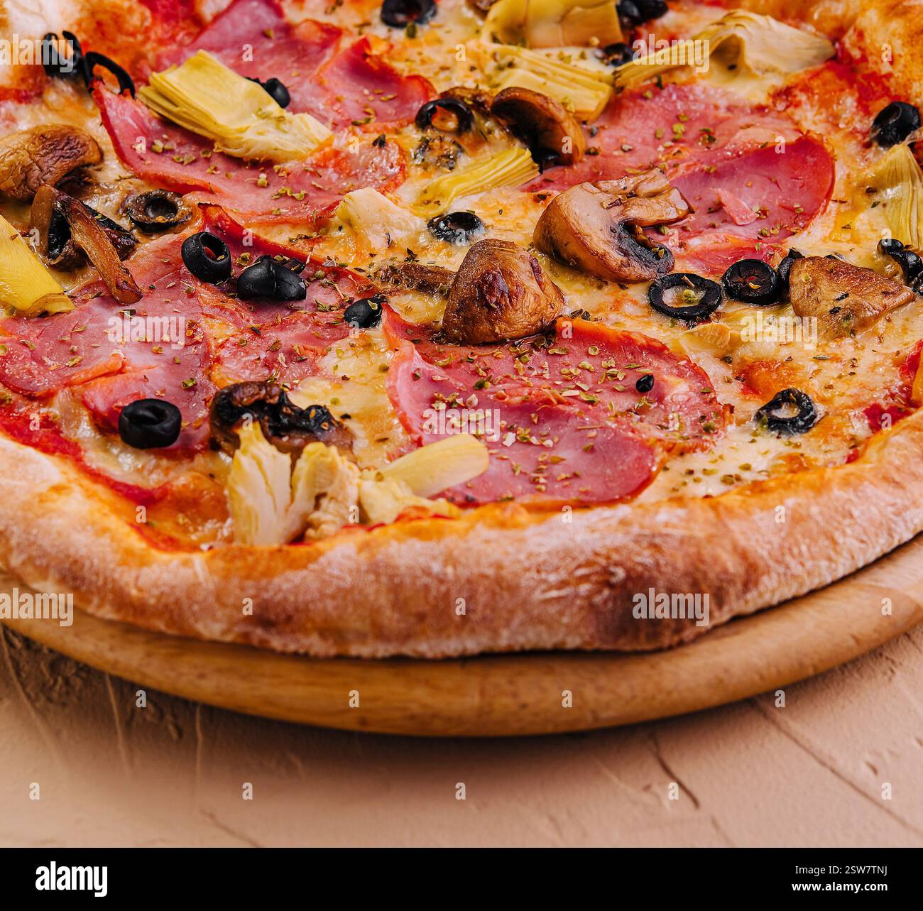 Delicious italian meat pizza with toppings Stock Photo - Alamy