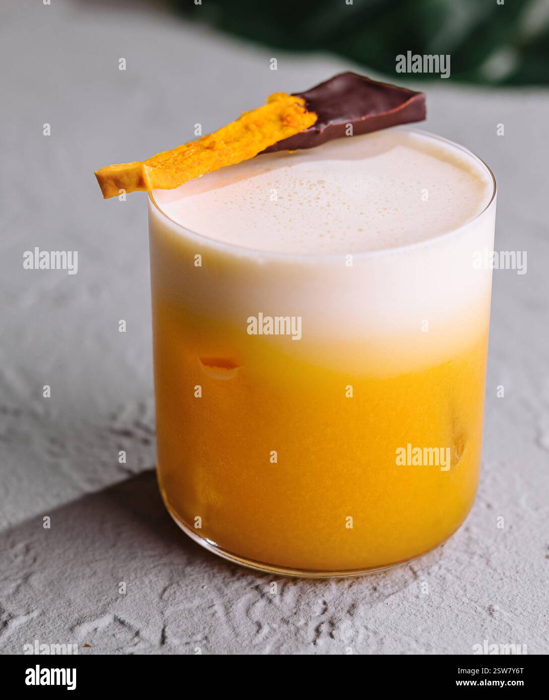Tropical mango cocktail with chocolate garnish Stock Photo - Alamy