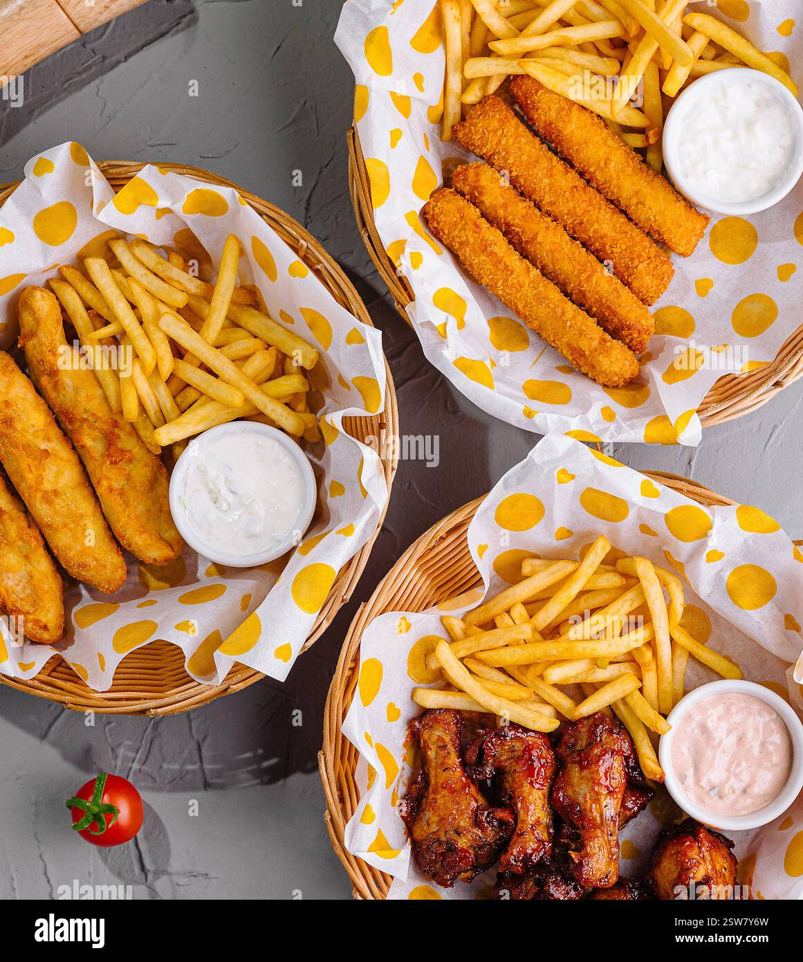 Assorted fast food platters on gray tabletop Stock Photo - Alamy